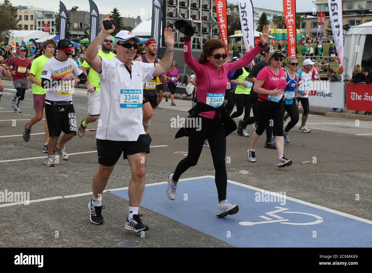 2014 City2Surf runners as they approach the finish line at Bondi Beach ...