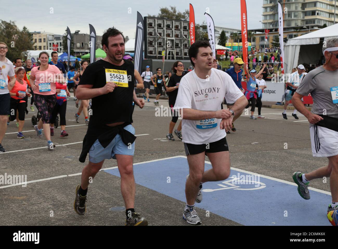 2014 City2Surf runners as they approach the finish line at Bondi Beach ...