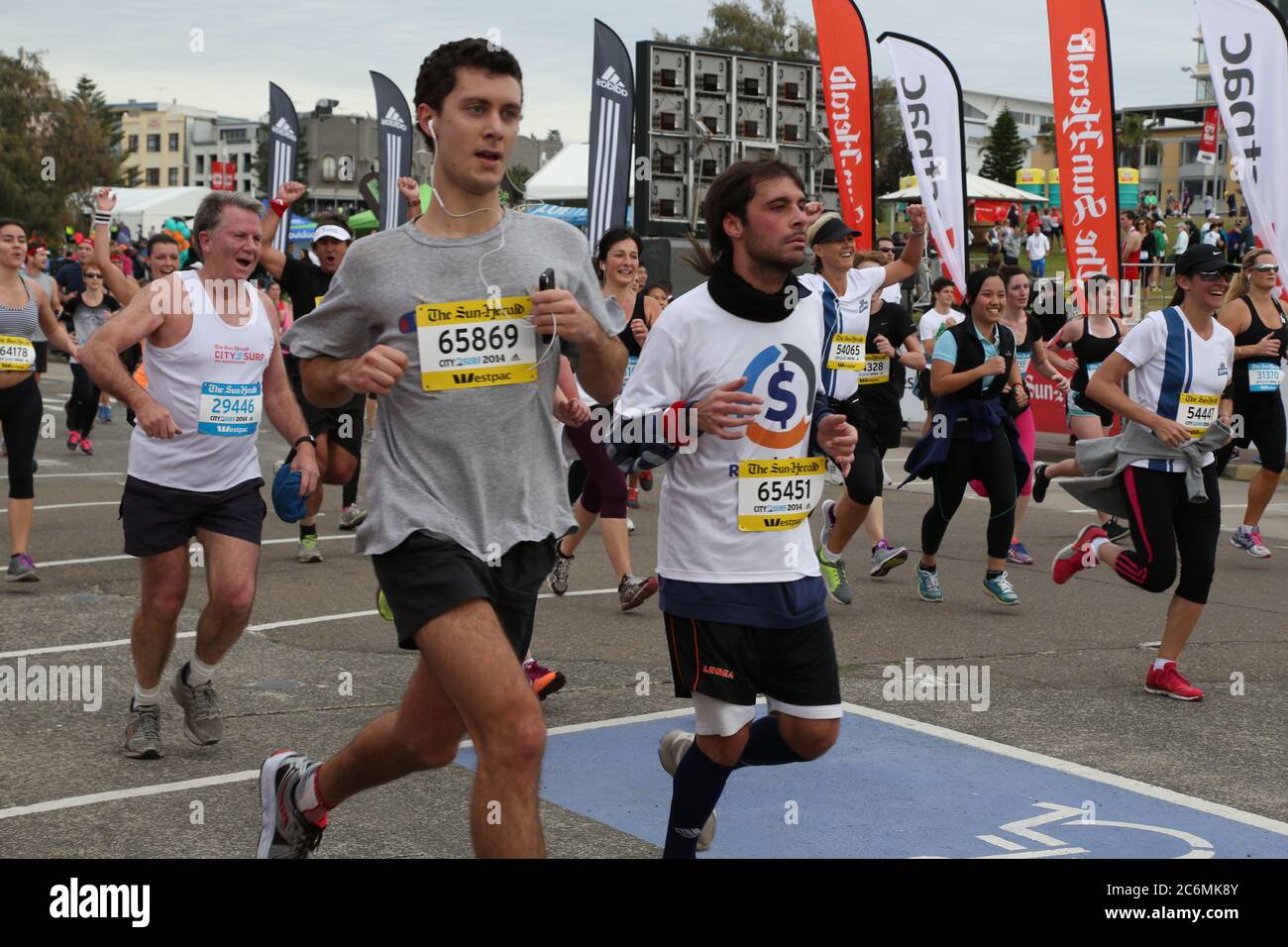 2014 City2Surf runners as they approach the finish line at Bondi Beach ...