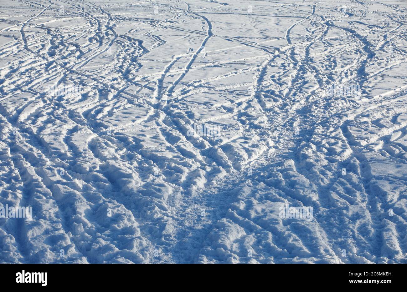 Snow surface full of all kinds of tracks and trails at lake Suontee ...