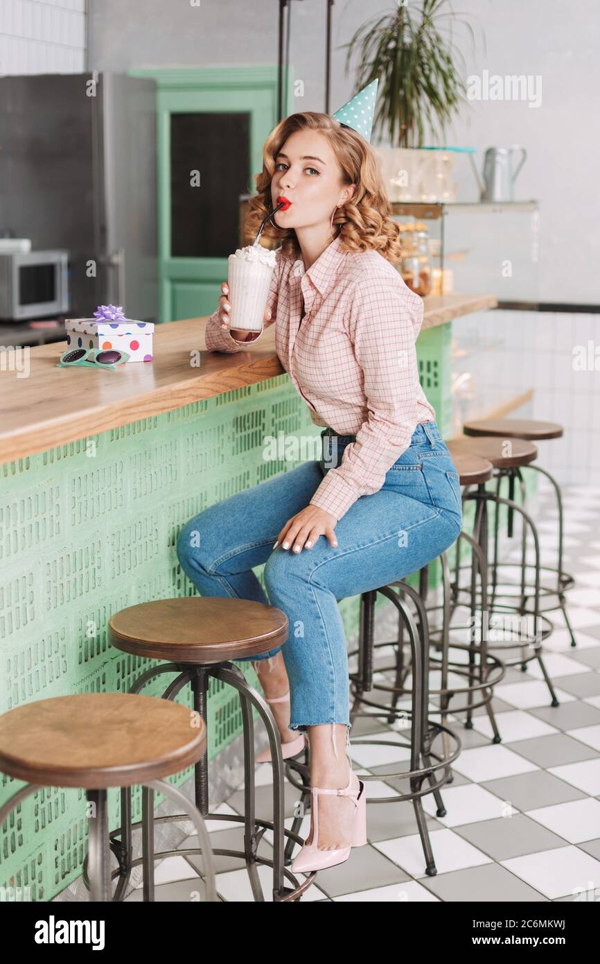 Vintage woman drinking milkshake hi-res stock photography and images ...