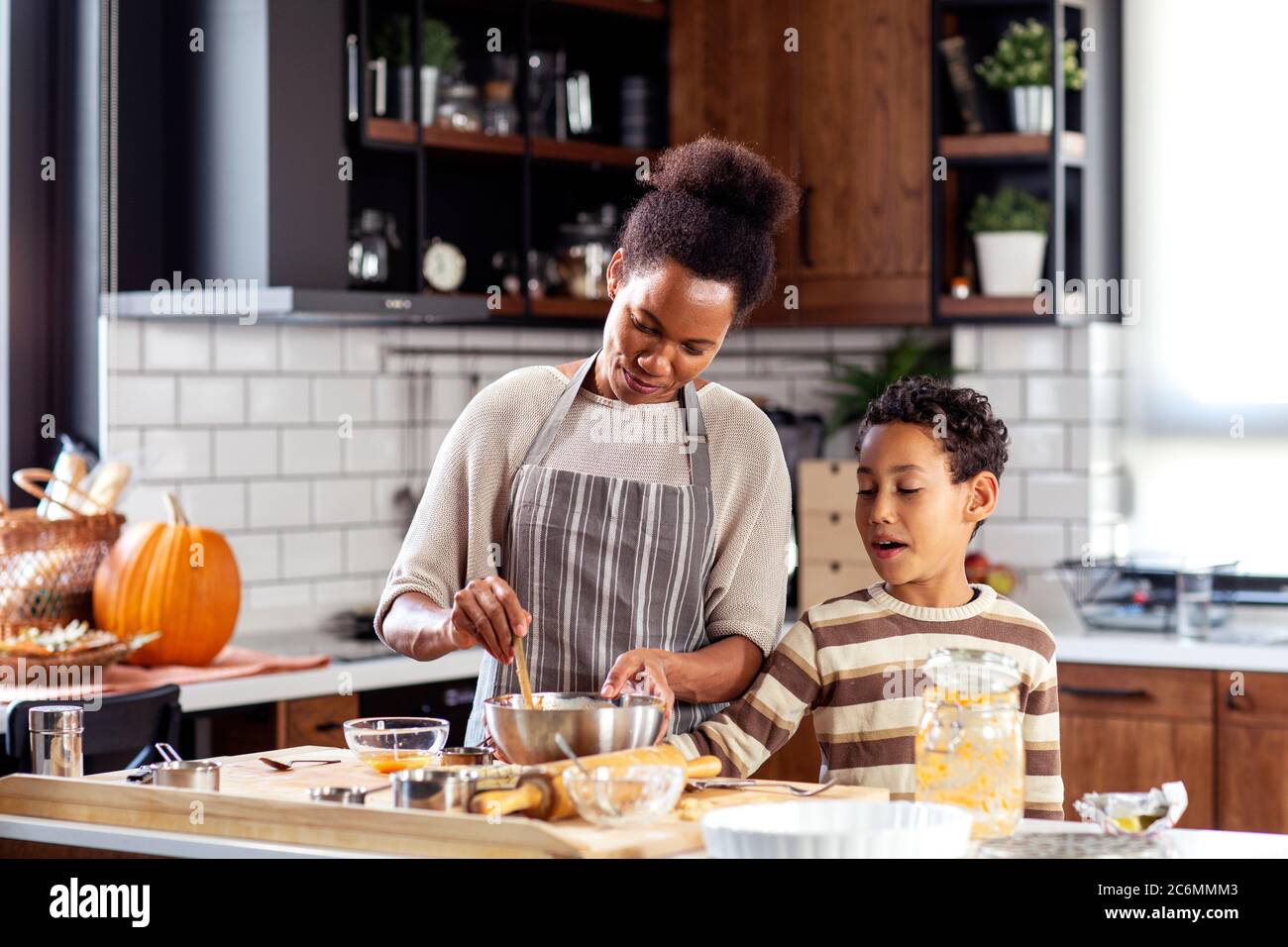 Mum and his son cook in the kitchen Stock Photo - Alamy