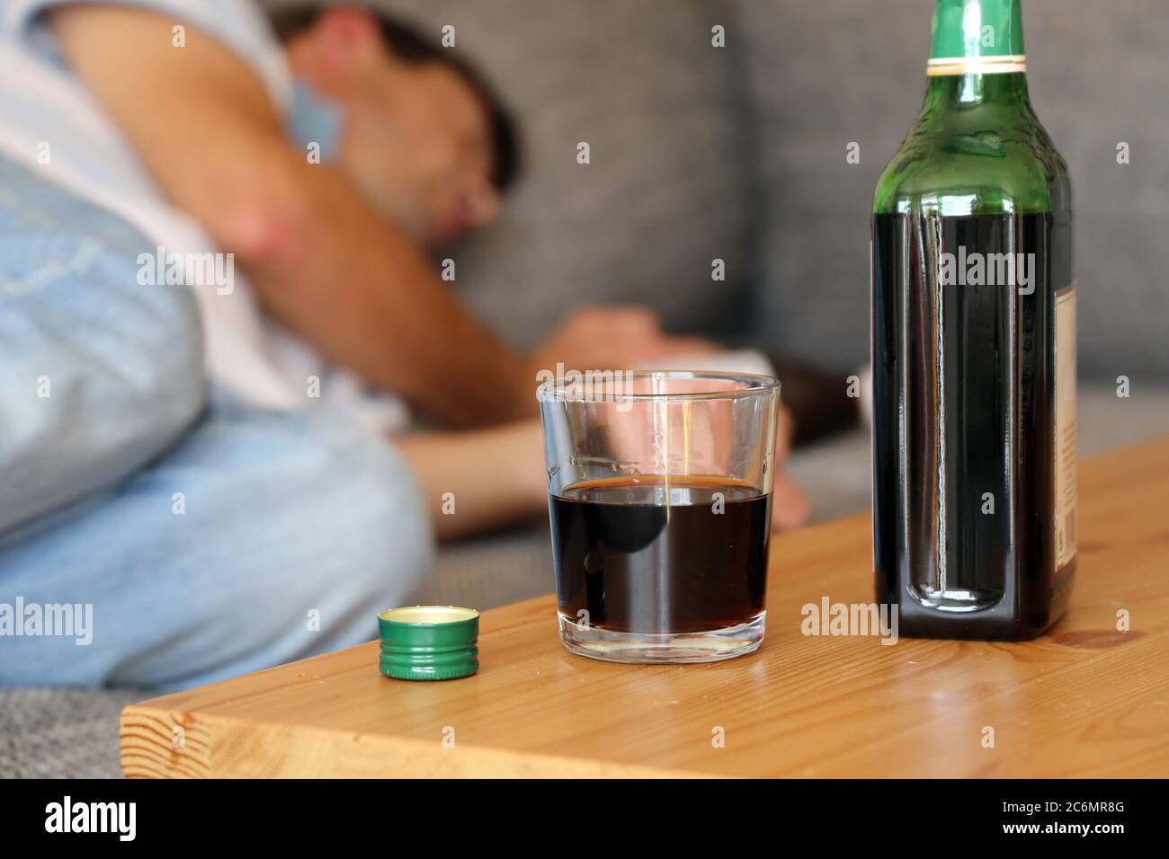 Symbol image: Man with drinking problems at home (Model released Stock ...