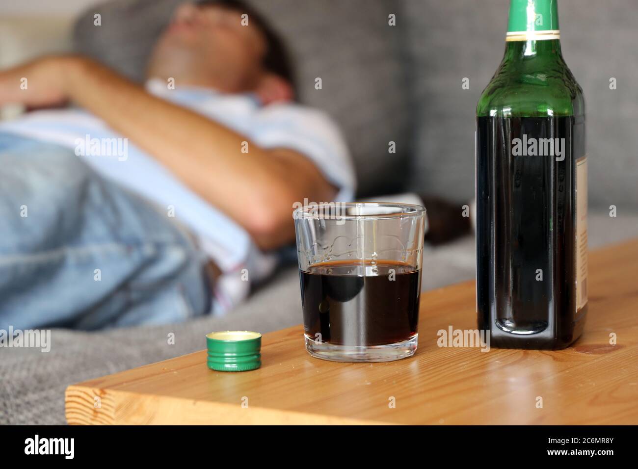 Symbol image: Man with drinking problems at home (Model released Stock ...