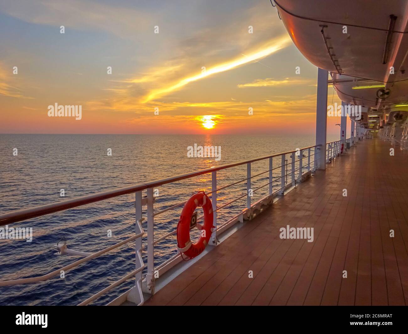Promenade bridge, cruise ship with sunset. sea view from the deck of a ...