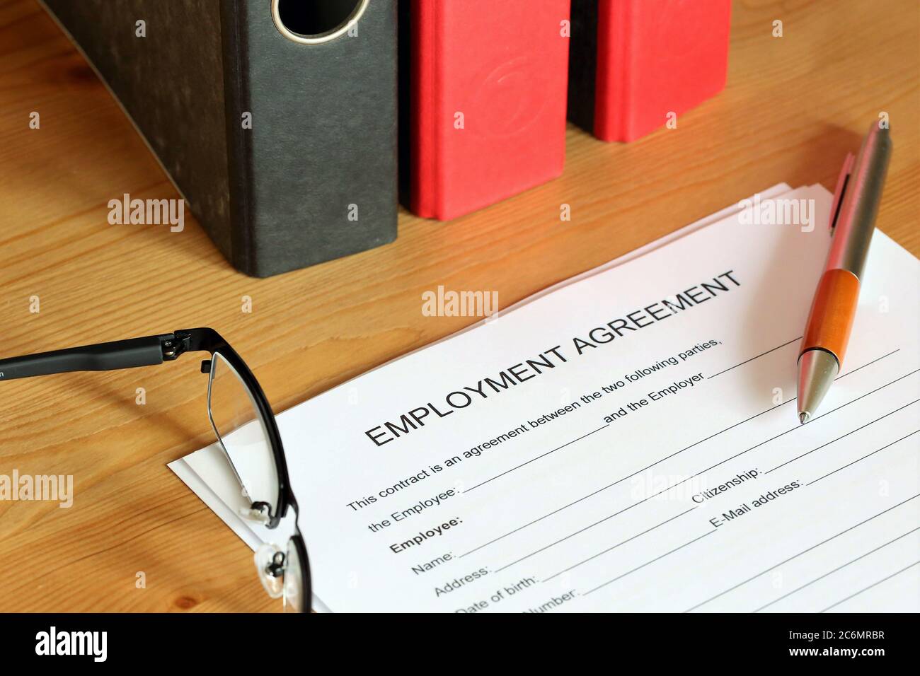 Symbol image: Blank form of an employment agreement on a desk Stock ...