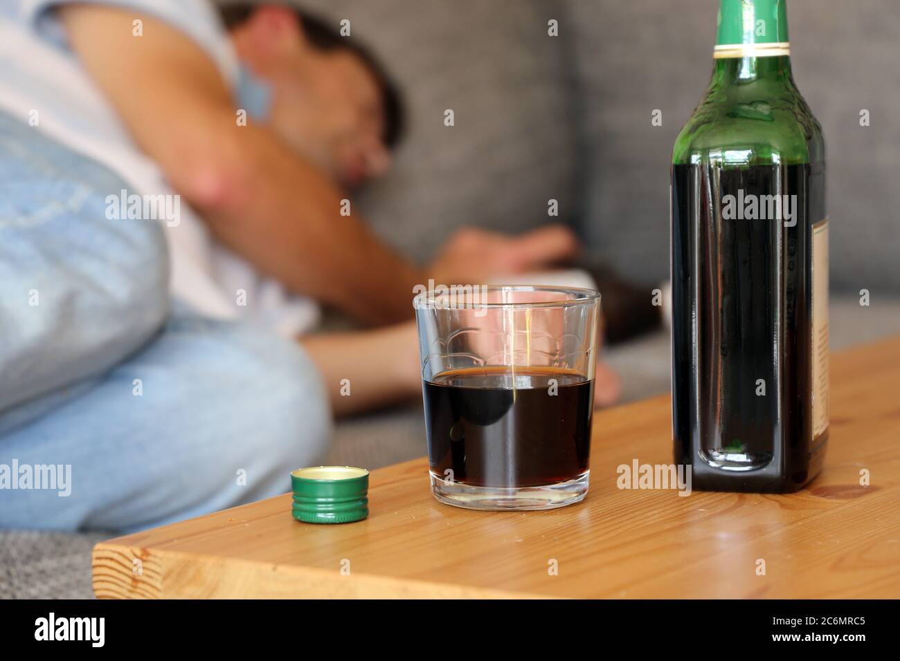Symbol image: Man with drinking problems at home (Model released Stock ...
