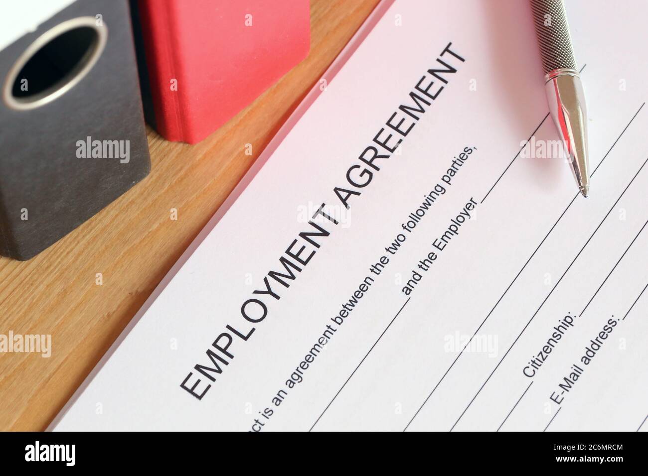 Symbol image: Blank form of an employment agreement on a desk Stock ...