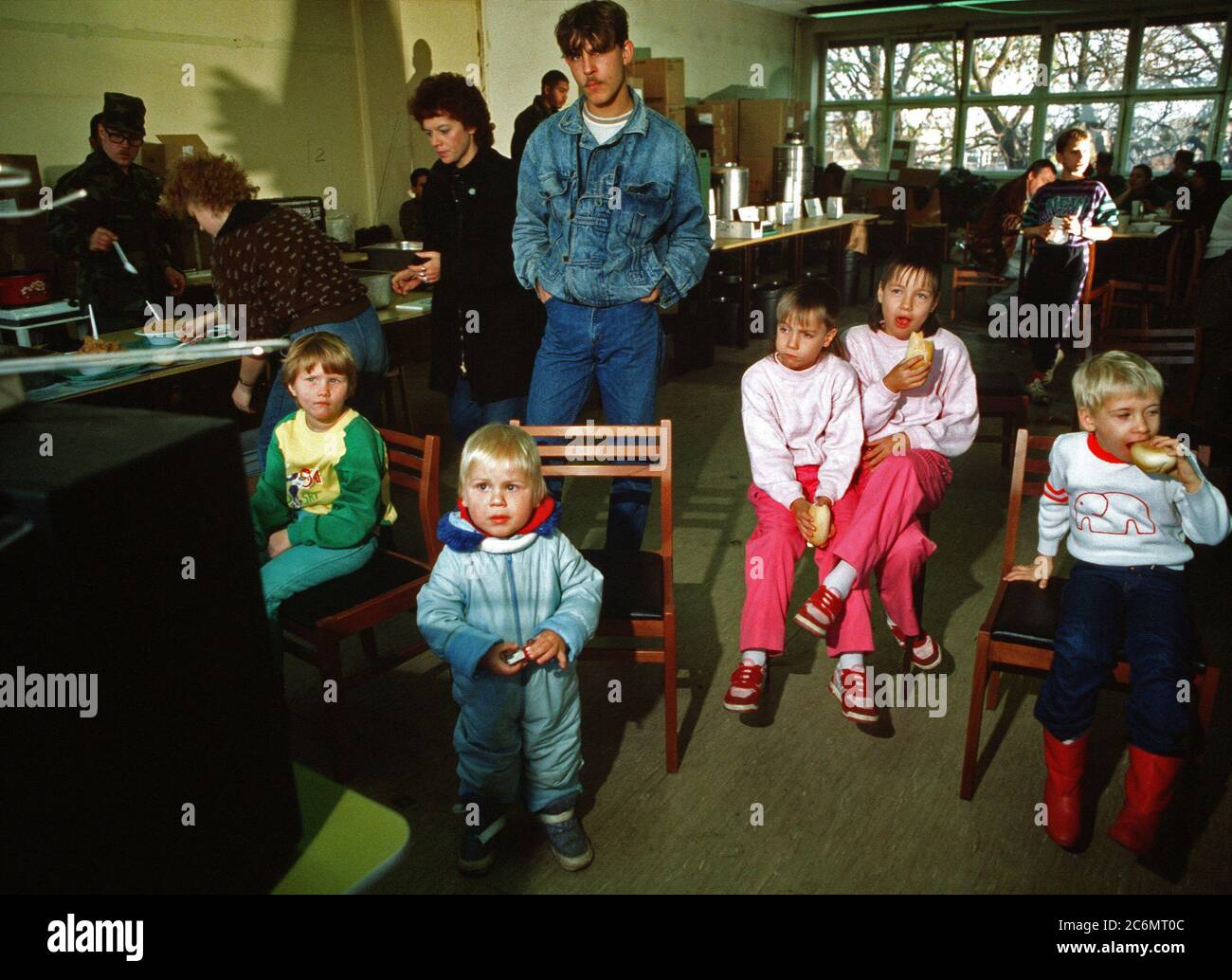 East German children enjoy a snack at the refugee center in West Berlin ...