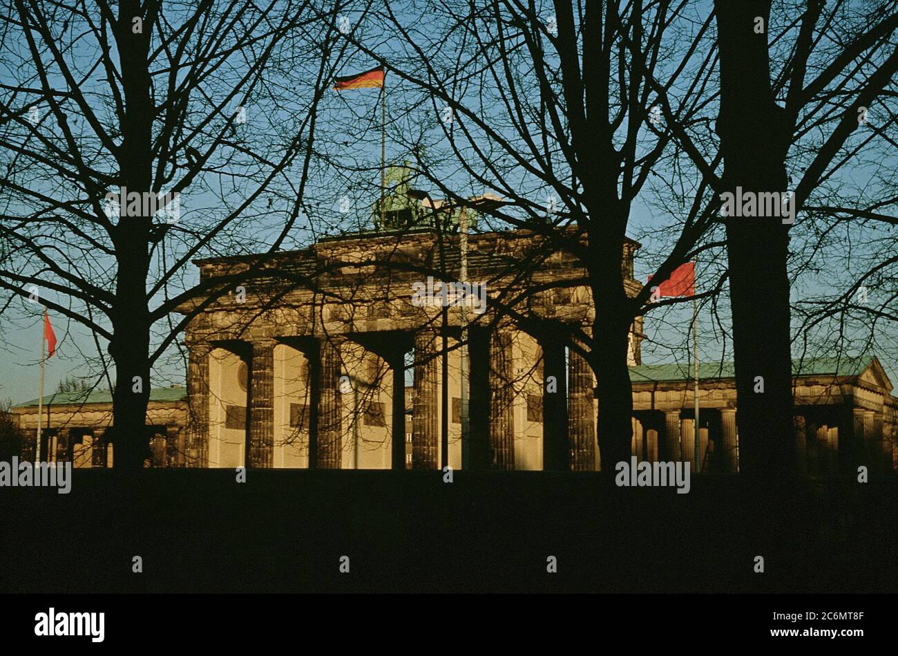 The East German flag flies atop the Brandenburg Gate Stock Photo - Alamy