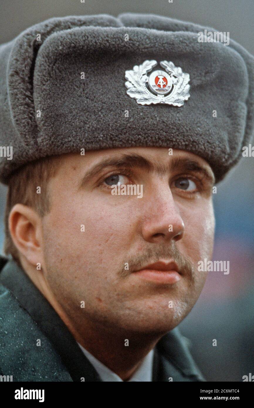 An East German guard observes activities prior to the official opening ...