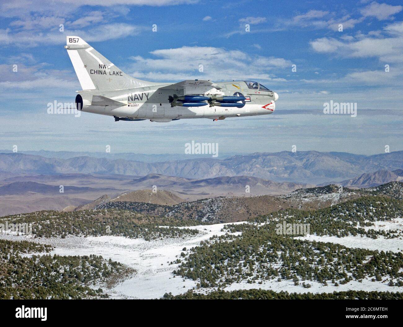 An air-to-air right side view of an A-7E Corsair II aircraft loaded ...