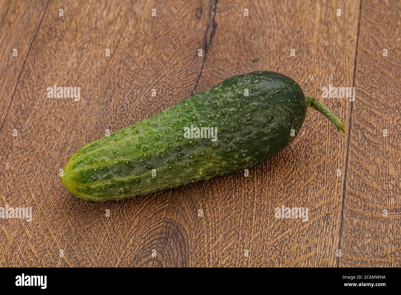 Green ripe fresh one cucumber over background Stock Photo - Alamy