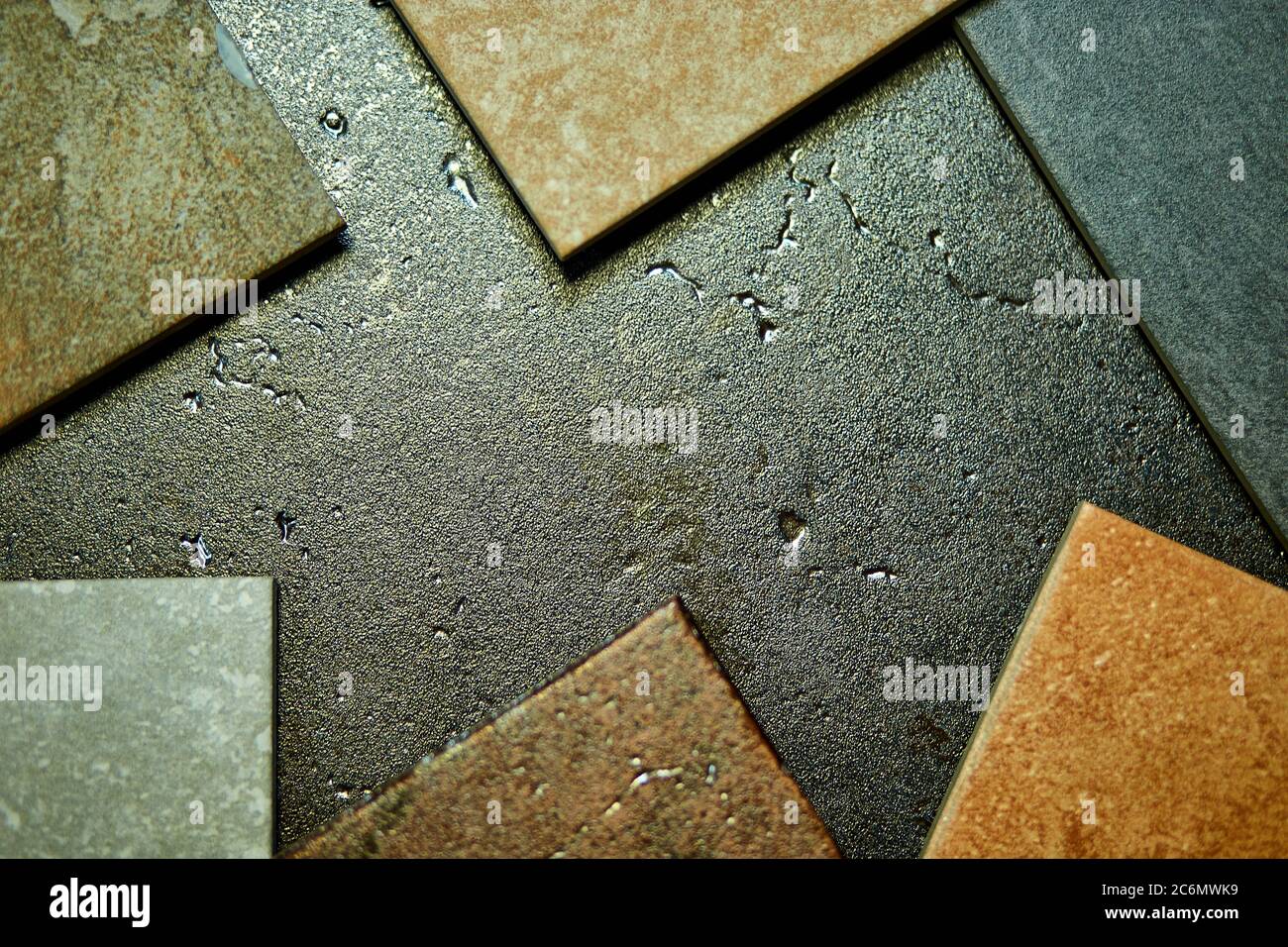 Frame of various different decorative tiles samples on stone background ...