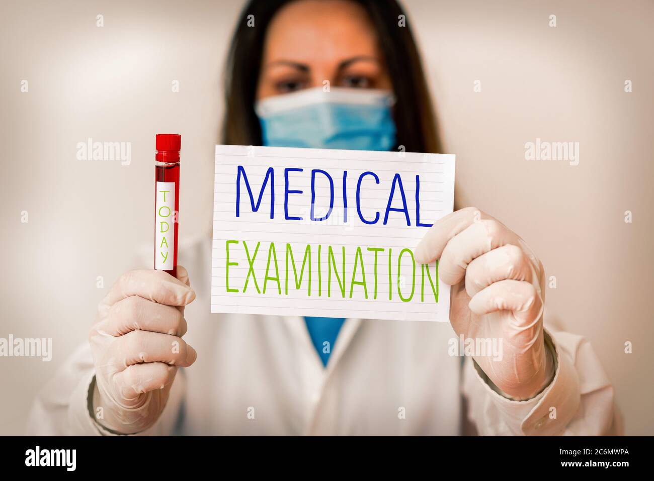 Writing note showing Medical Examination. Business concept for the ...