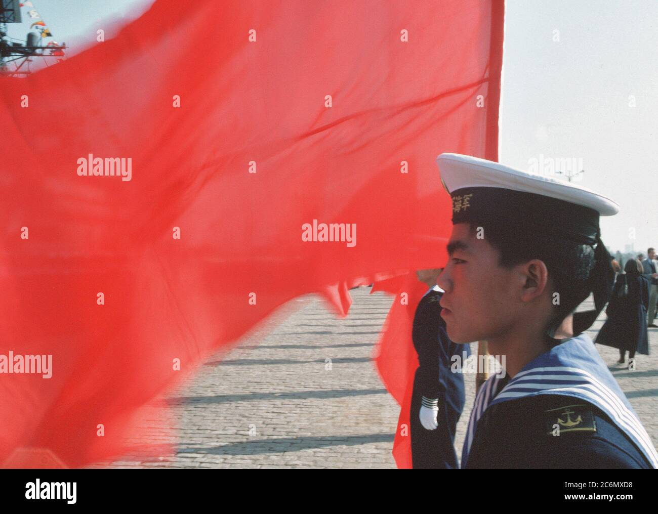 A Chinese sailor parades the Chinese colors during the first visit by ...