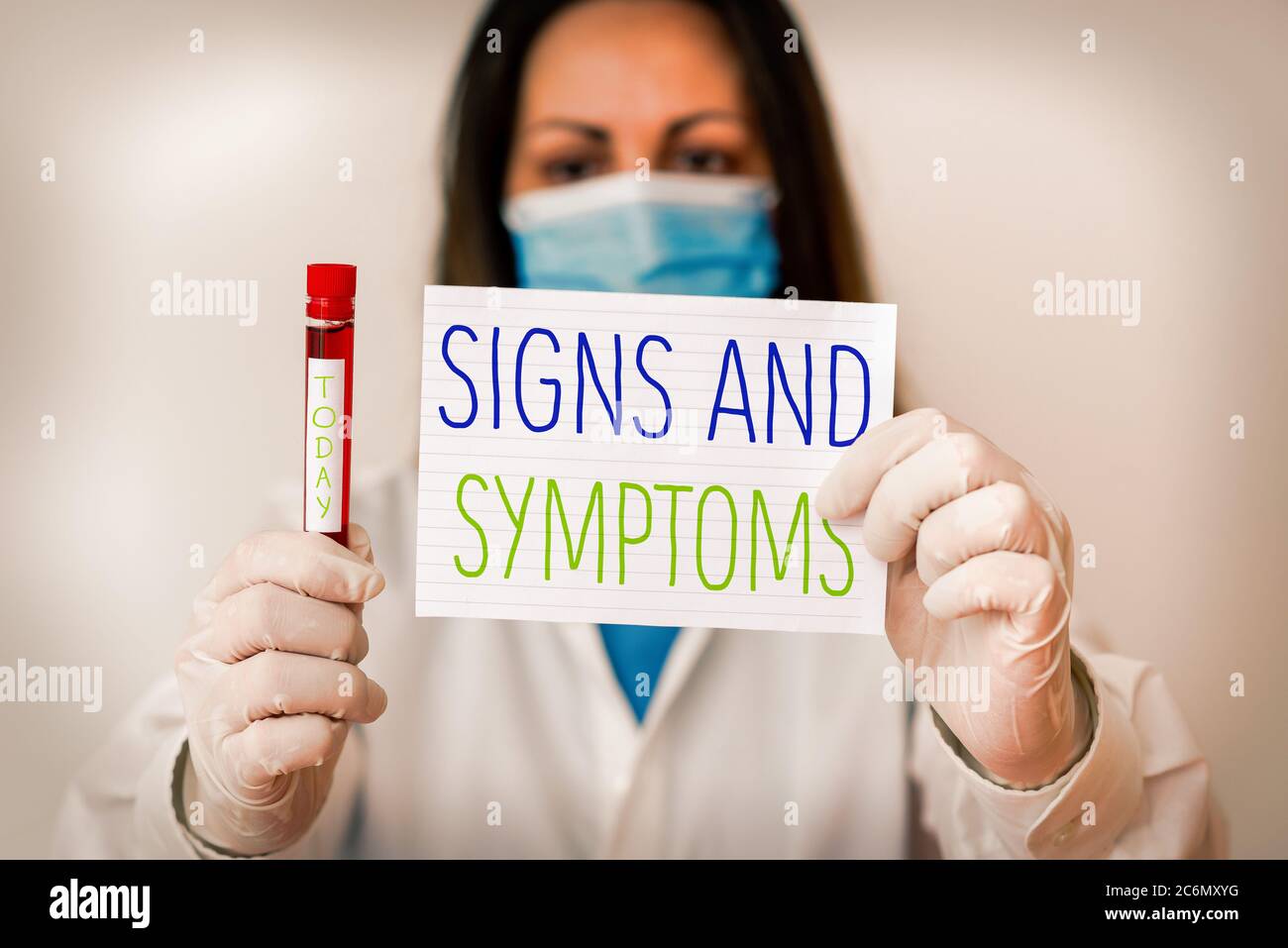 Writing note showing Signs And Symptoms. Business concept for ...