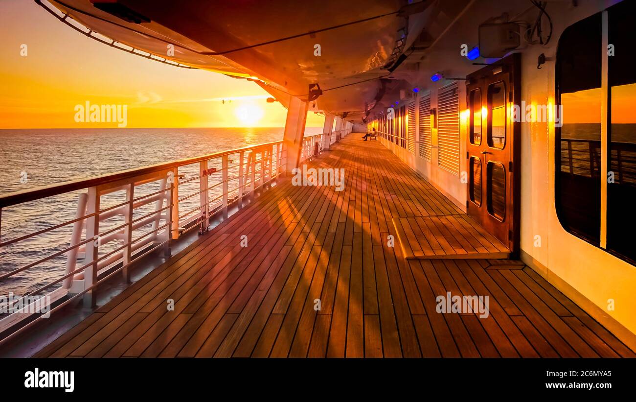 Promenade bridge, cruise ship with sunset. sea view from the deck of a ...