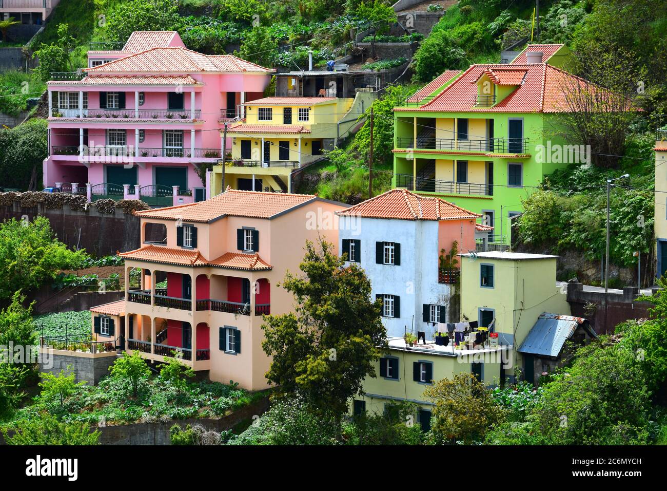 Colorful houses in green, pink, orange, blue and yellow. The small town ...