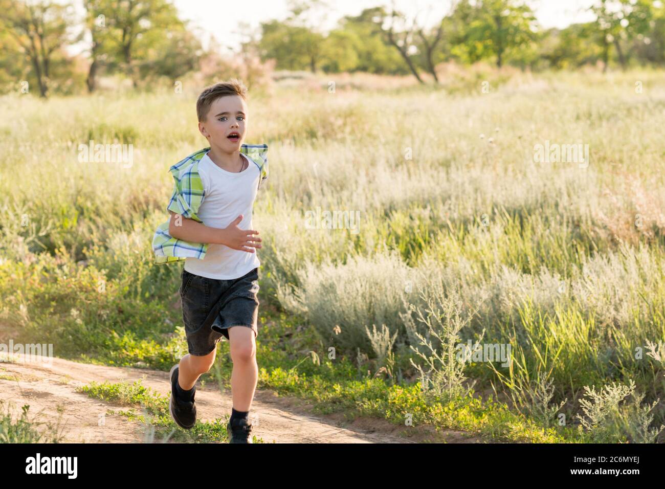 Emotional portrait of a happy and cheerful little boy, running and ...