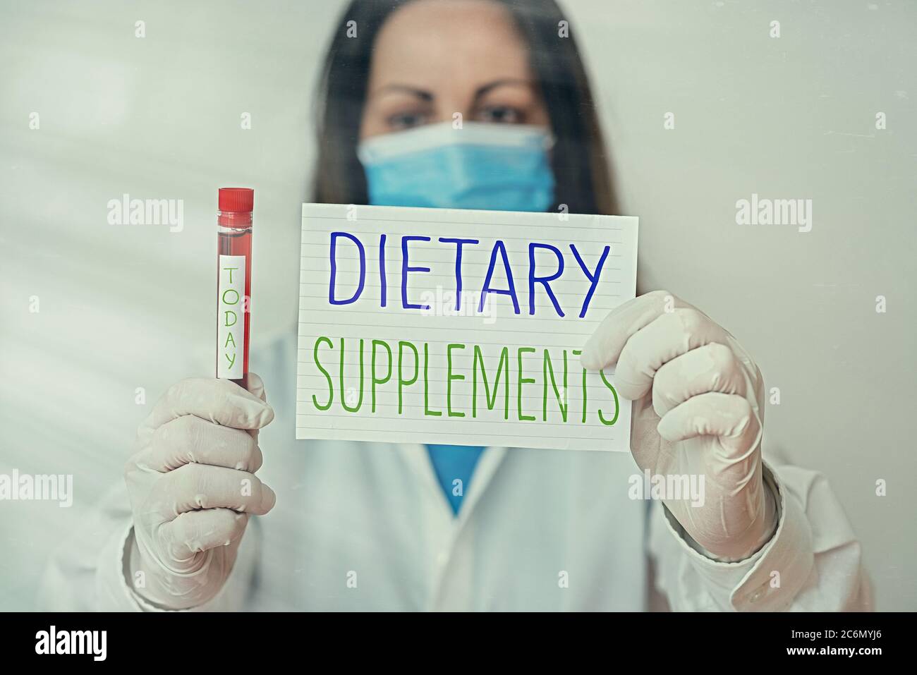 Writing note showing Dietary Supplements. Business concept for product ...