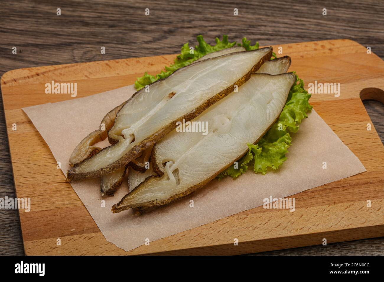 Delicous smoked halibut fish slices snack Stock Photo - Alamy