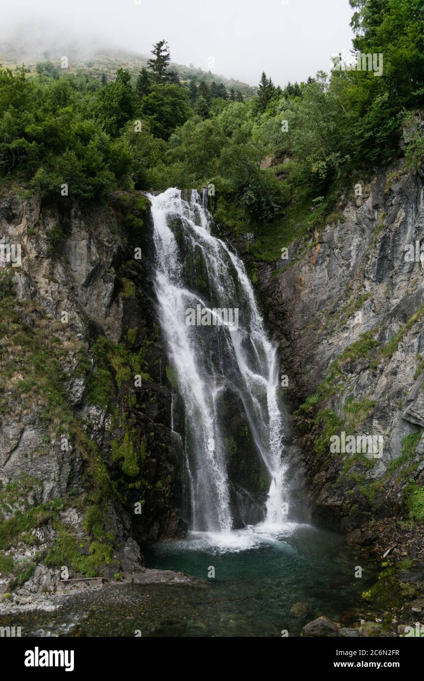 Impressive waterfall inside the forest Stock Photo - Alamy