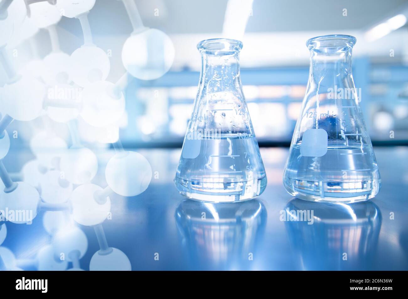 two blue science flask with chemistry molecular structure in blue ...