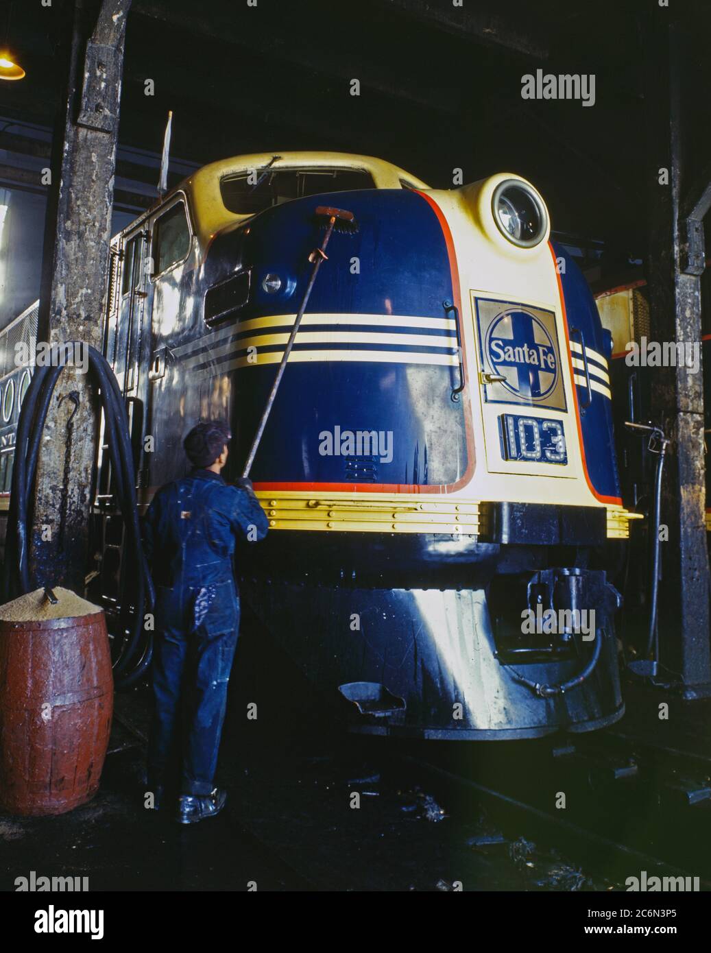 Washing one of the Santa Fe R.R. 54 hundred horse power diesel freight ...