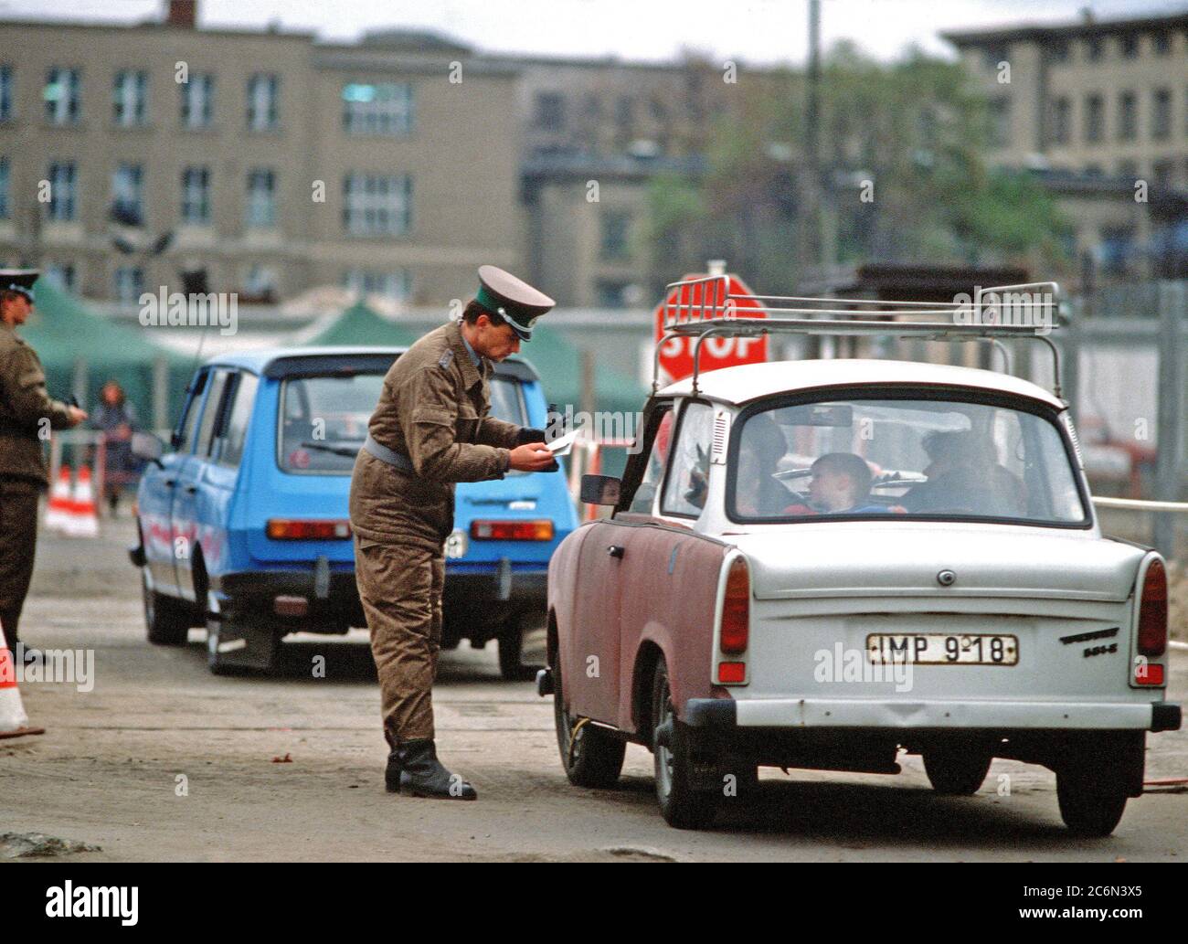 An East German policeman monitors traffic returning to East Berlin ...