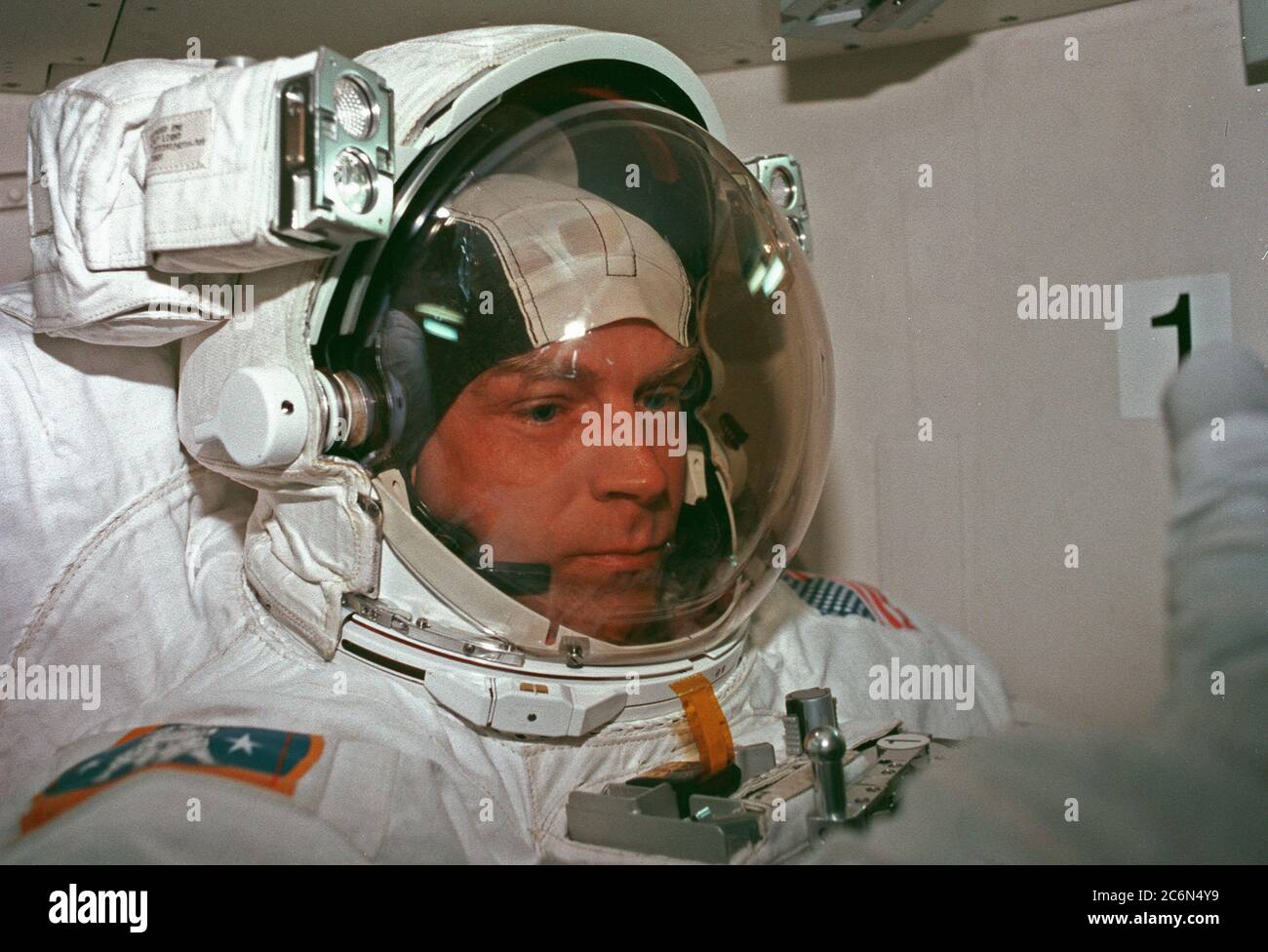 (11-21 Feb. 1997) --- Attired in the Extravehicular Mobility Unit (EMU ...