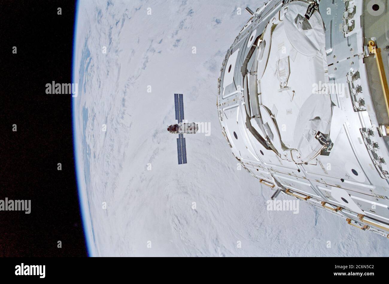 (6 Dec. 1998) --- Backdropped against a blanket of heavy cloud cover ...