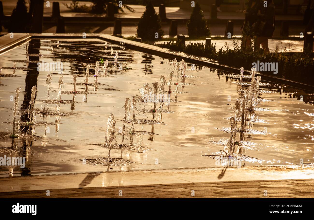 an ornamental pool where water dances in sunlight, reflections Stock ...
