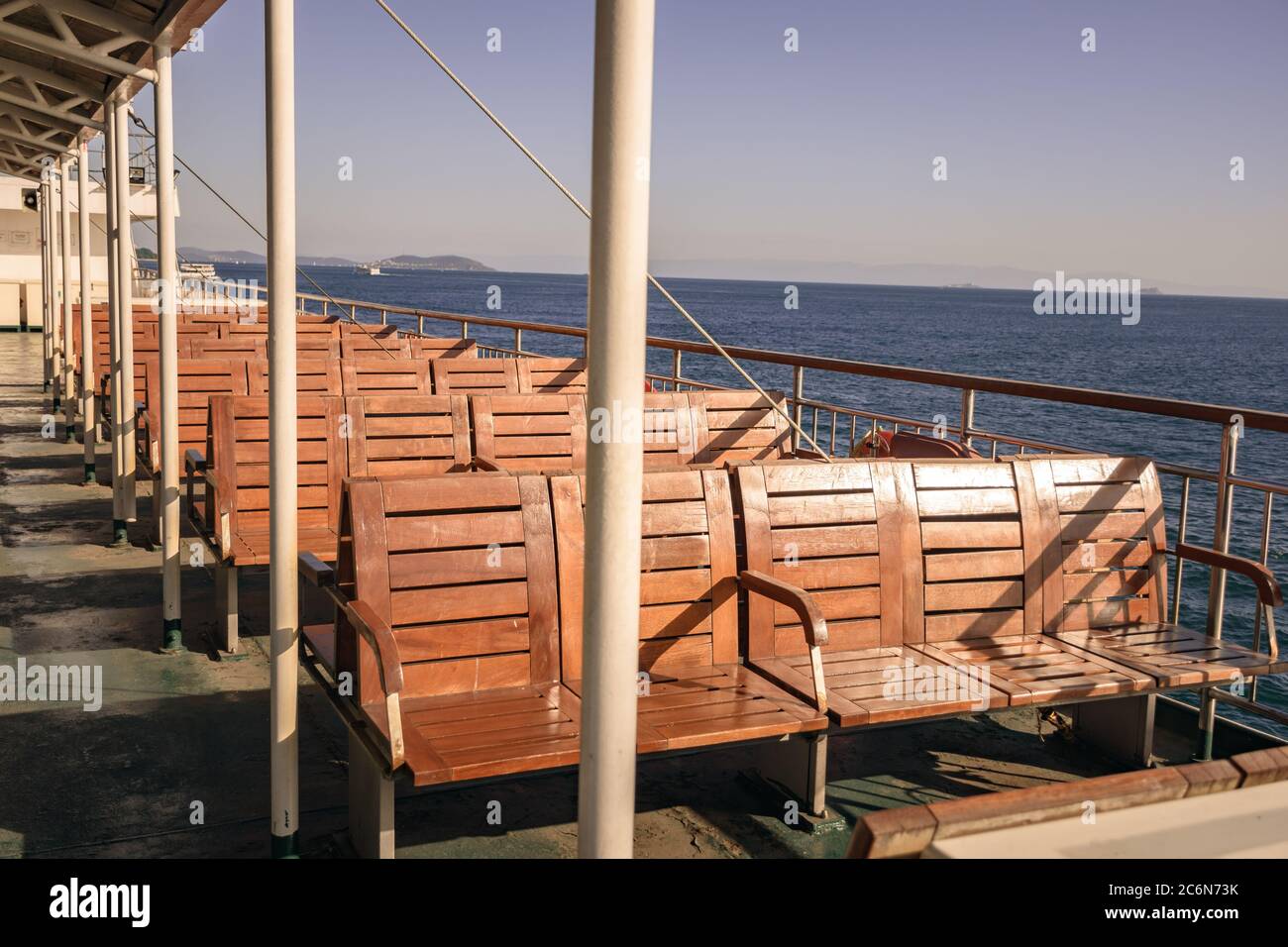 empty seats on ferry terrace, blue sky and sea as background Stock ...