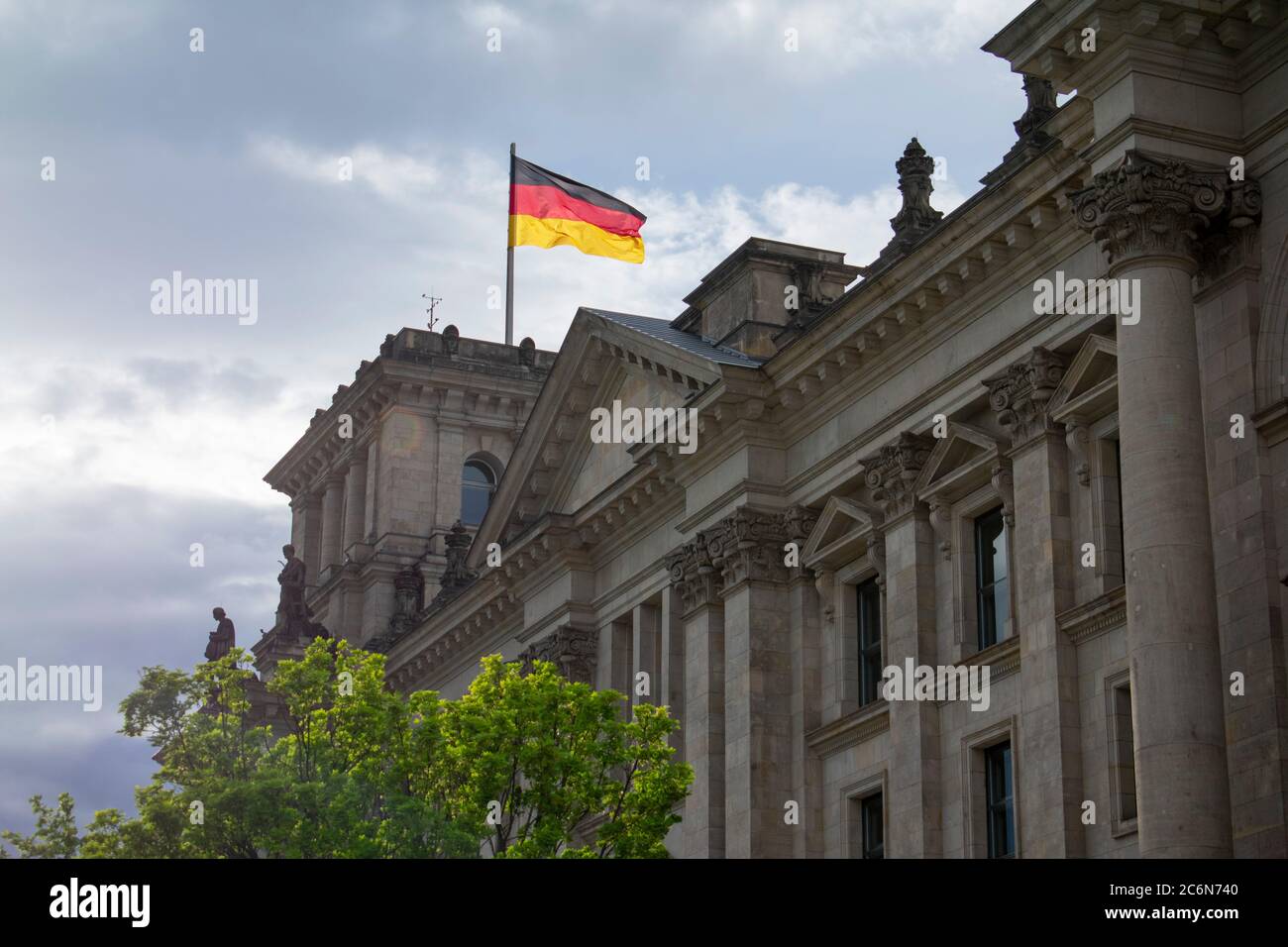 German flag flying on top of the Reichstag building in Mitte Berlin ...