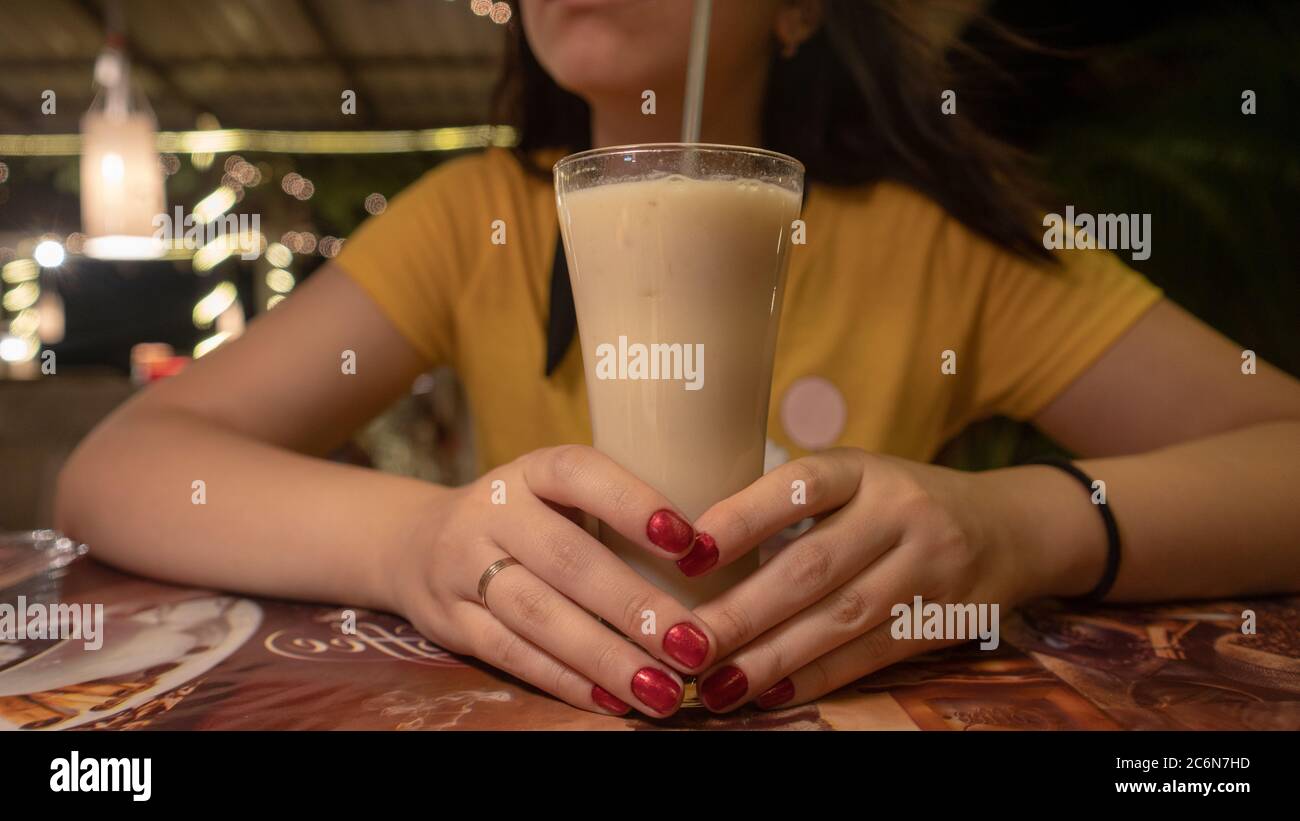 Sipping drink through straw hi-res stock photography and images - Alamy