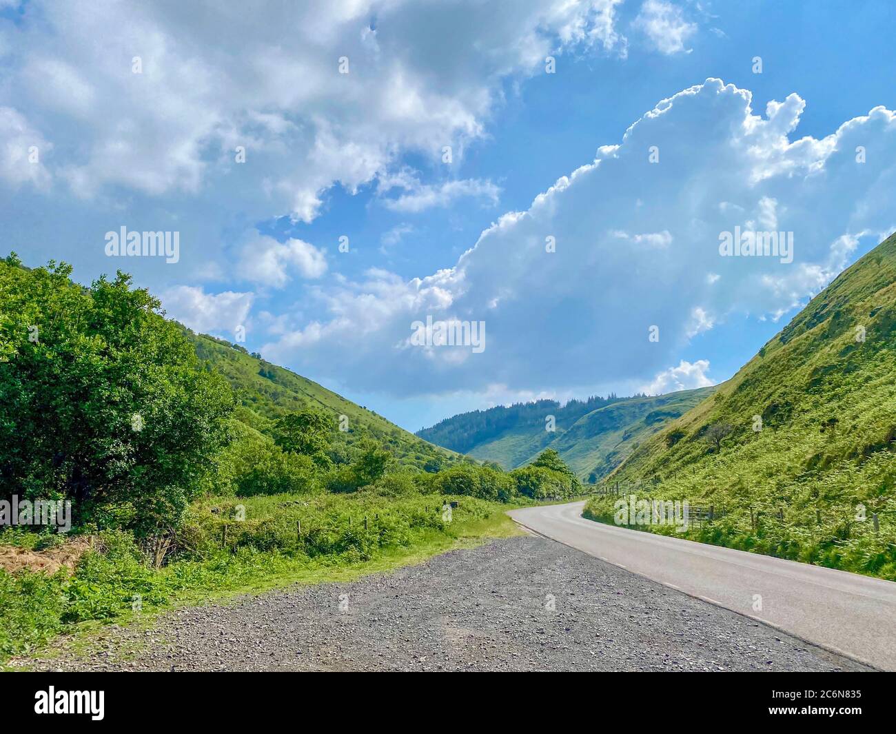 Steep hills rise either side of the Sulby River valley in the beautiful ...