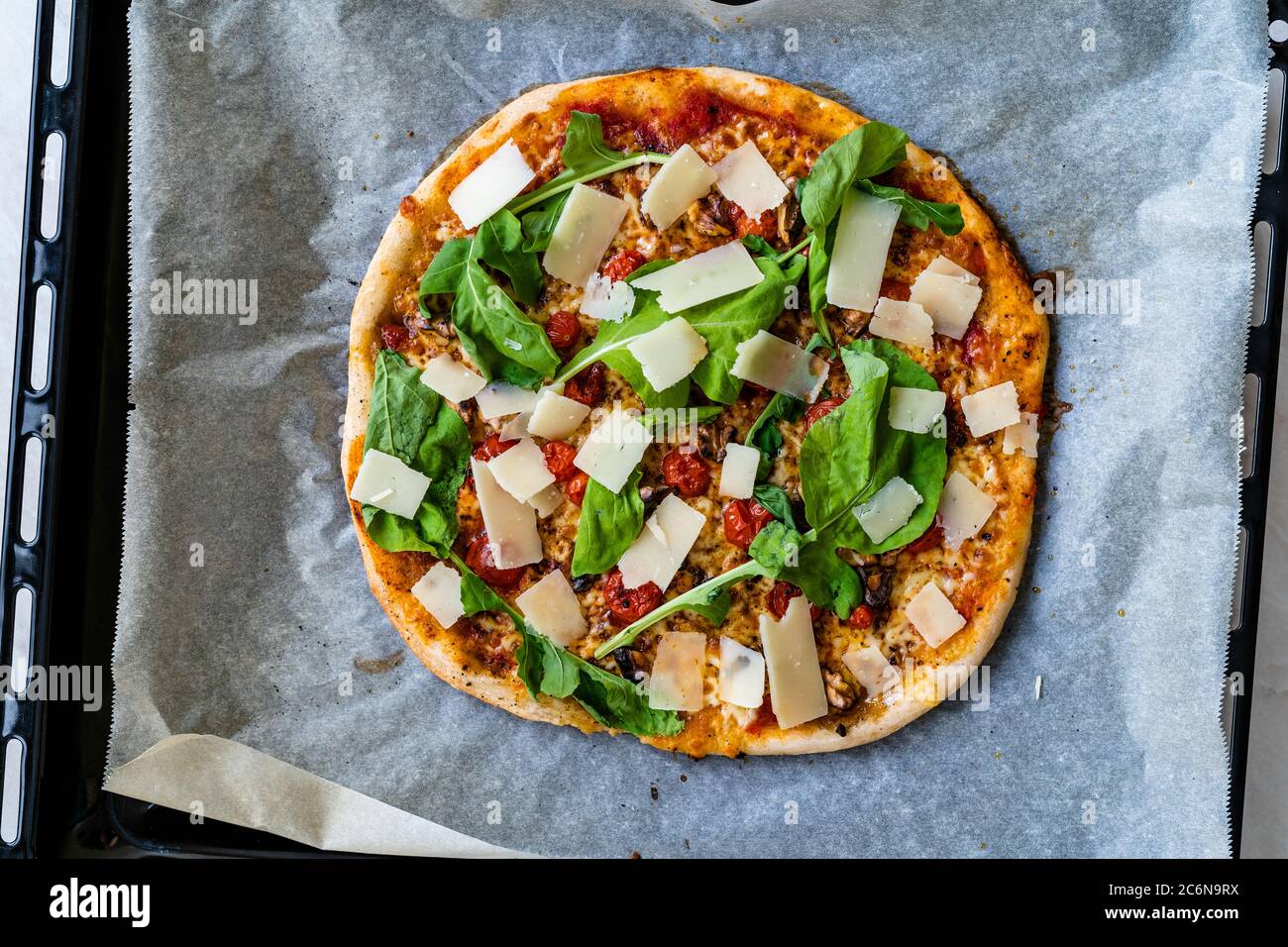 Homemade Pizza with Parmesan Cheese Slice, Rucola, Arugula or Rocket ...