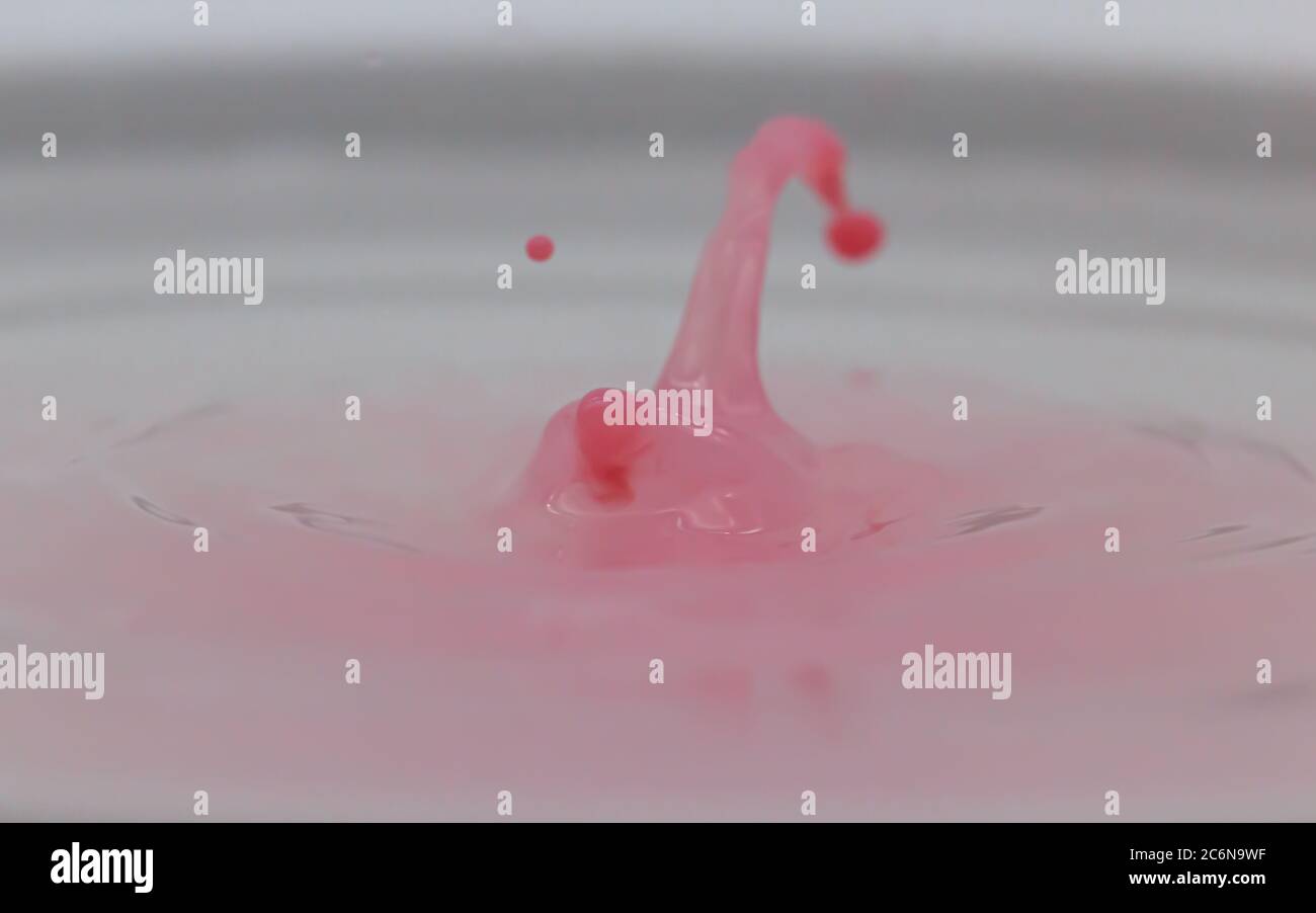 pink Water drop and splash creative forms made Stock Photo - Alamy