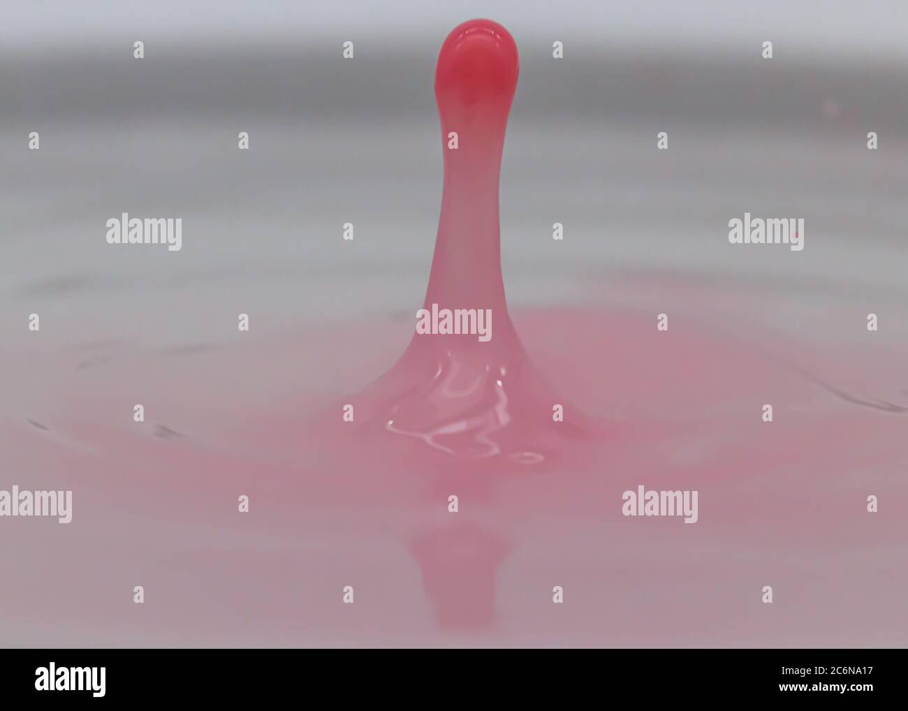 pink Water drop and splash creative forms made Stock Photo - Alamy