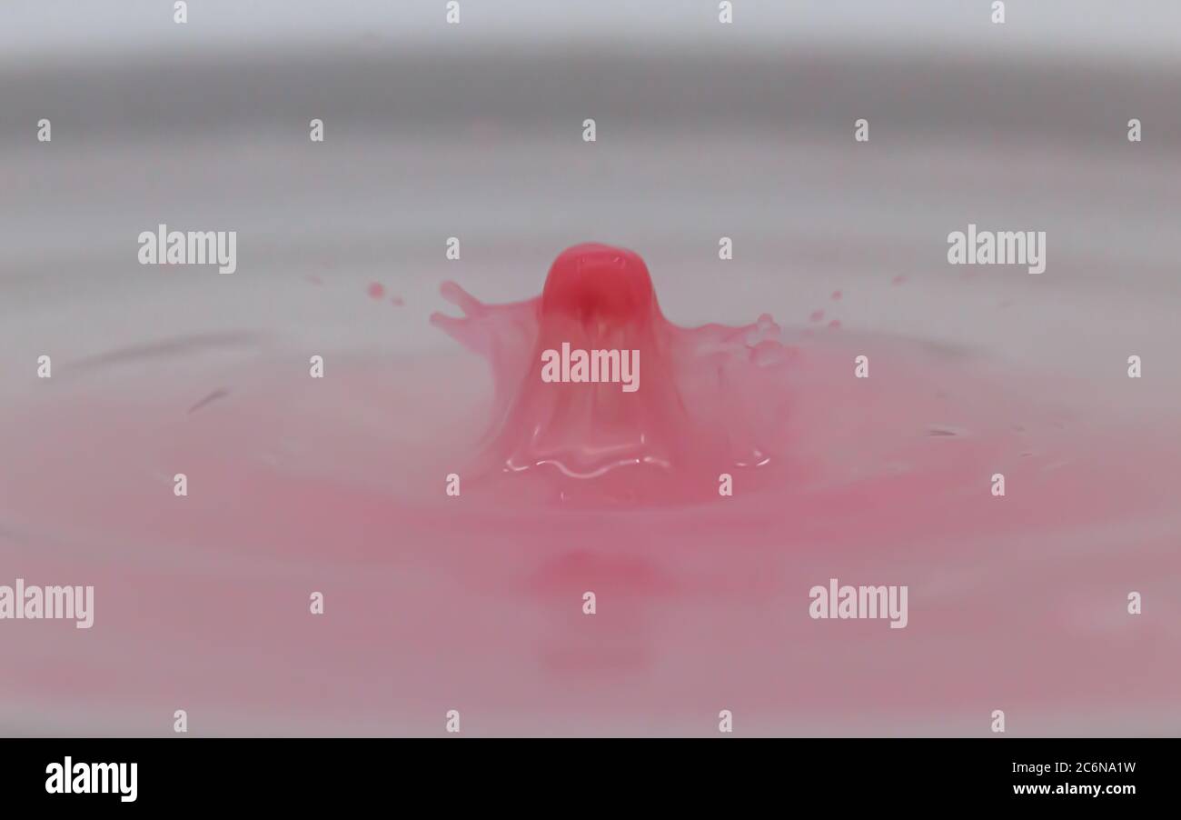 pink Water drop and splash creative forms made Stock Photo - Alamy