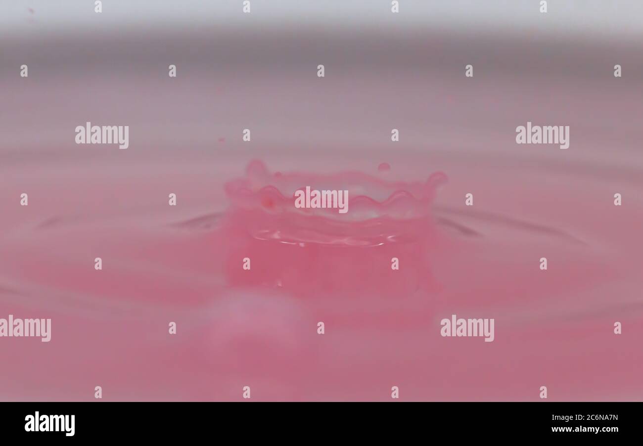 pink Water drop and splash creative forms made Stock Photo - Alamy
