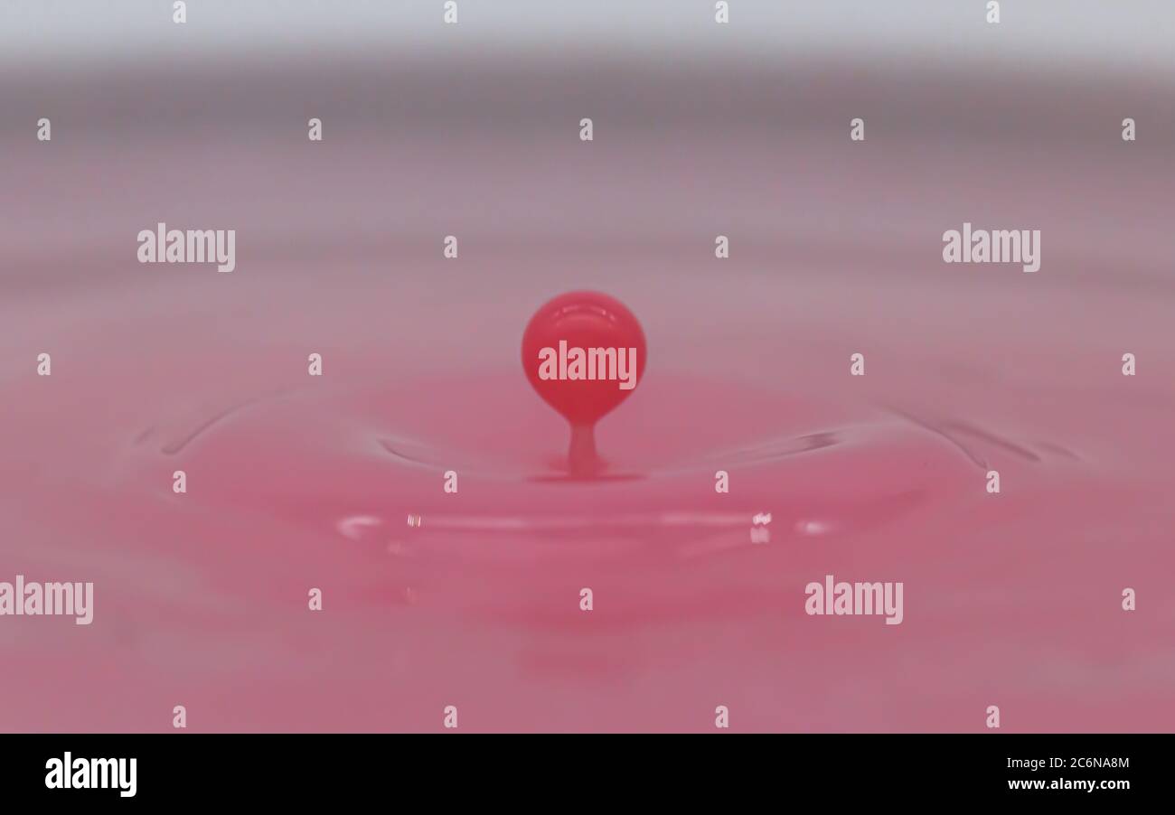pink Water drop and splash creative forms made Stock Photo - Alamy