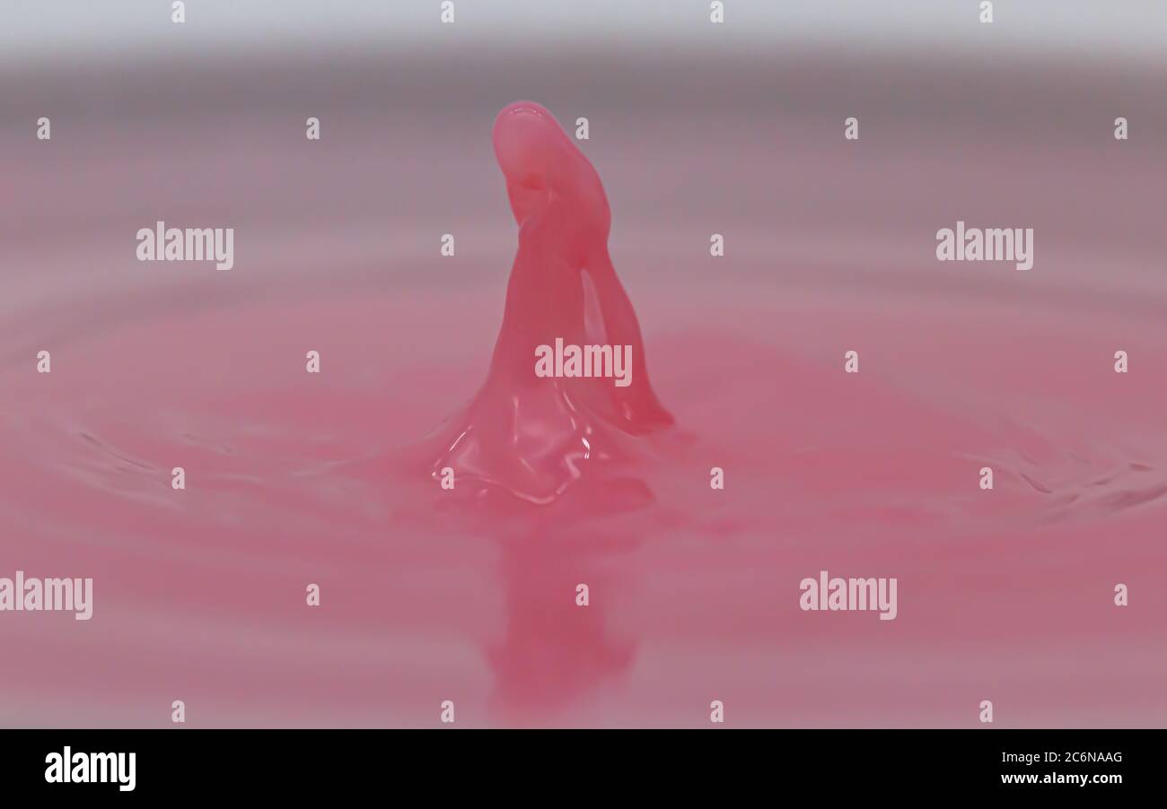 pink Water drop and splash creative forms made Stock Photo - Alamy