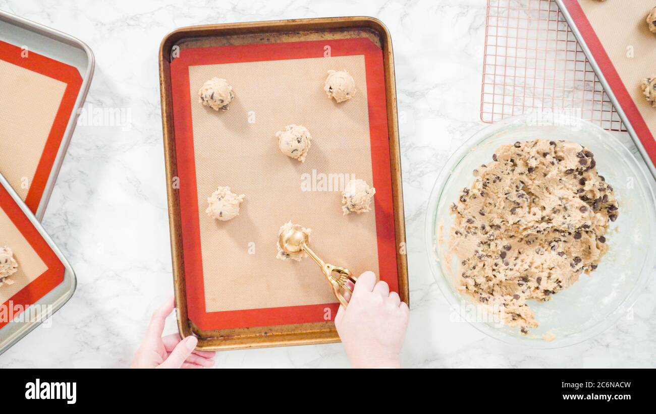 Step by step. Flat lay. Scooping homemade chocolate chip cookies with ...