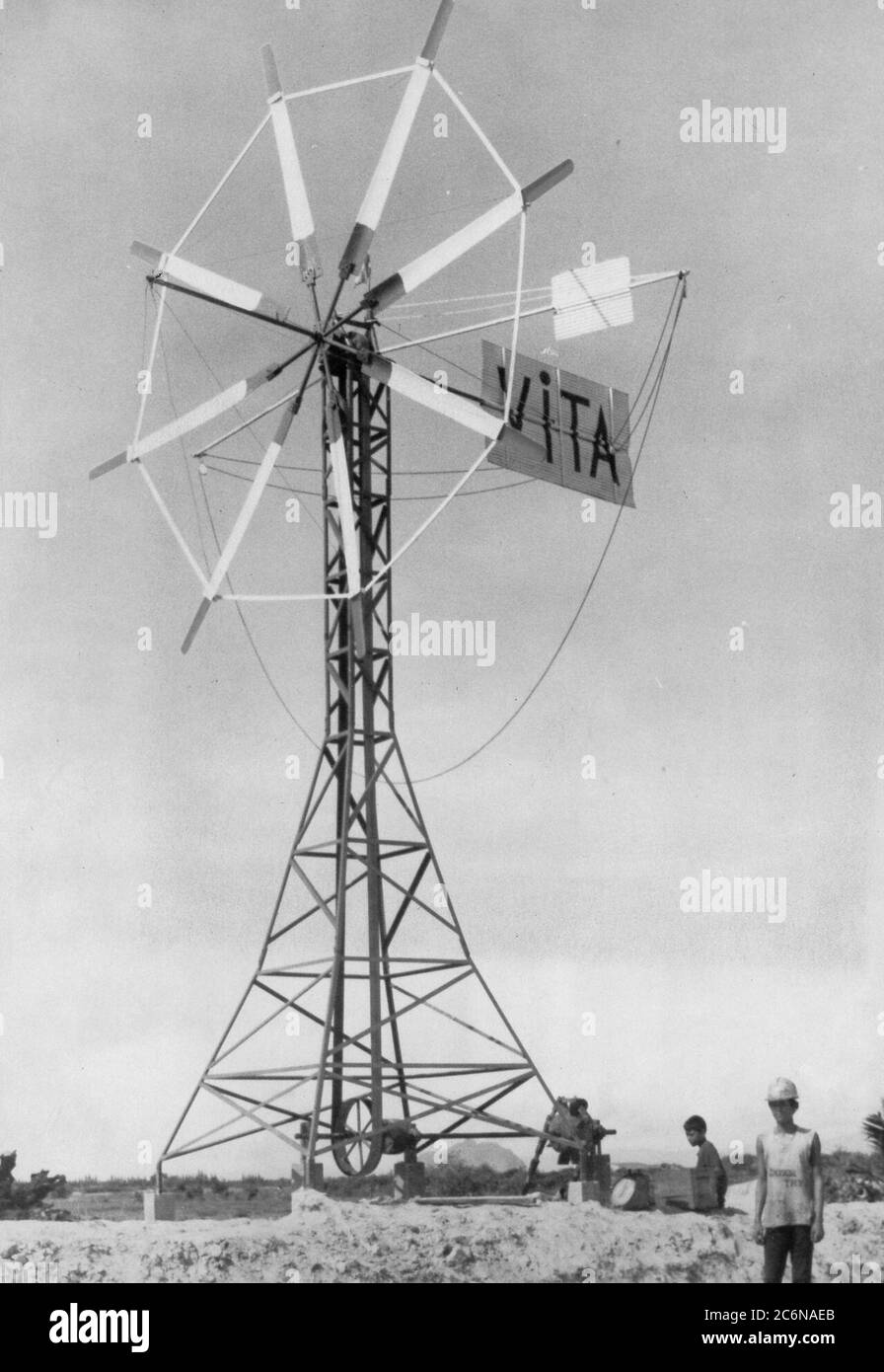 A windmill in the desert Stock Photo - Alamy