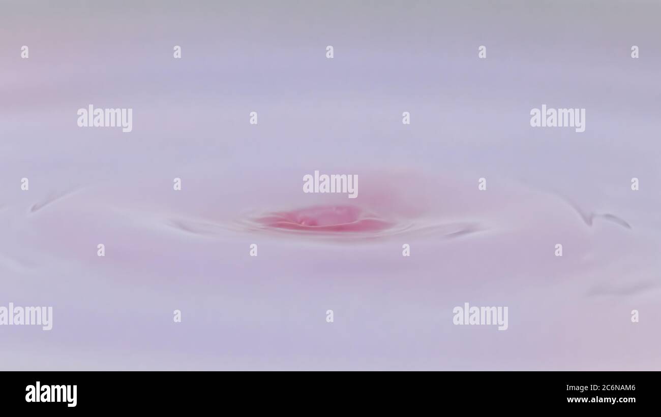 Red color drop in light blue water and splash creative forms made Stock ...