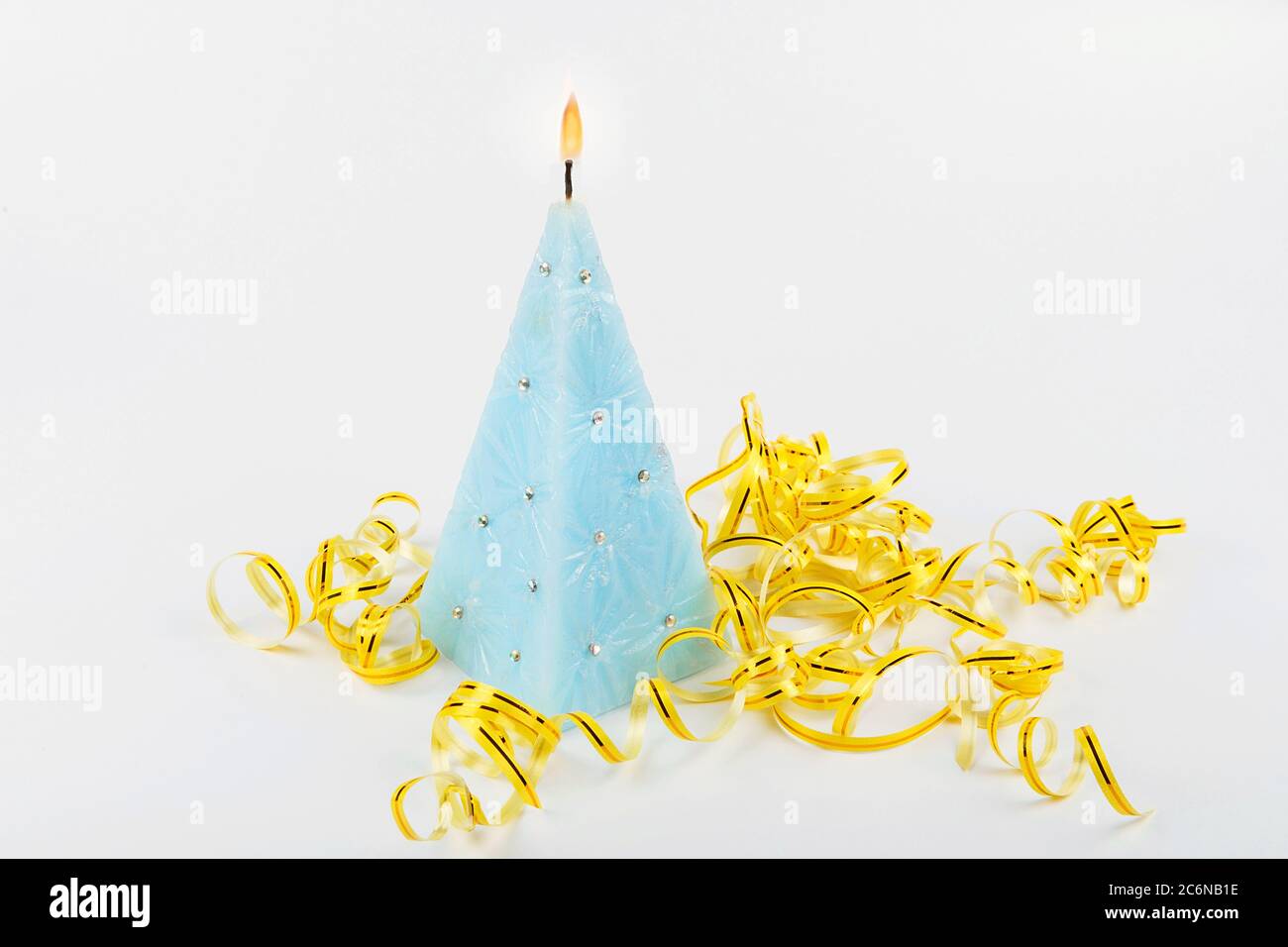 Decorative Handmade candle in the shape of a pyramid on white ...