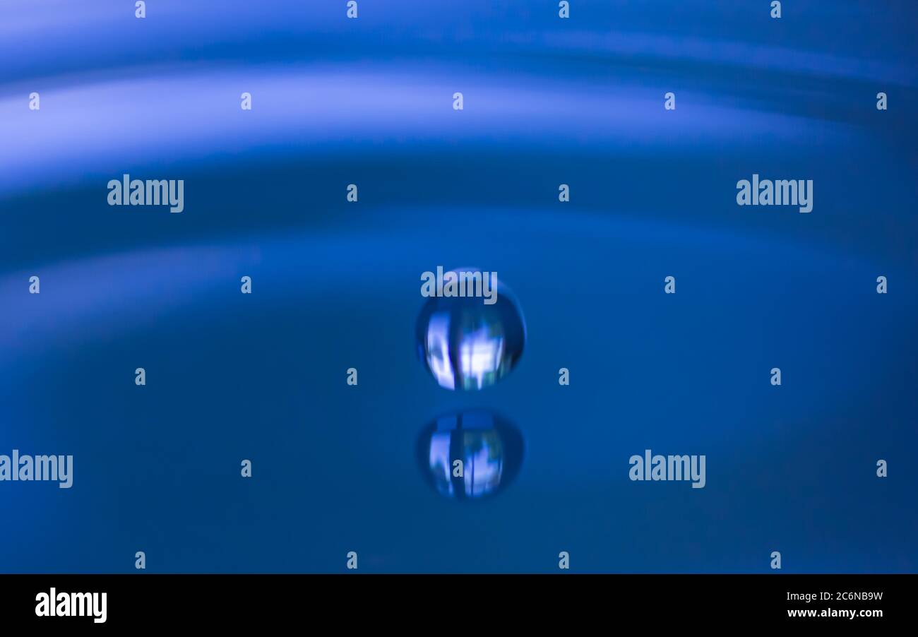 Light blue color drop in water and splash creative forms made Stock ...