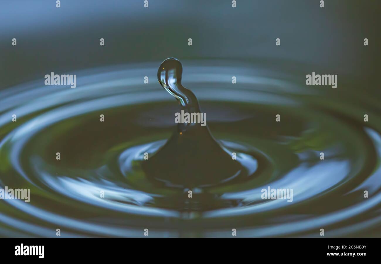 color drop in water and splash creative forms made Stock Photo - Alamy